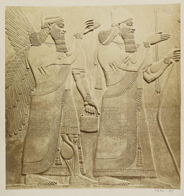 Assyrian relief of King Ashurnasirpal II and a god from Nimroud, ca. B ...