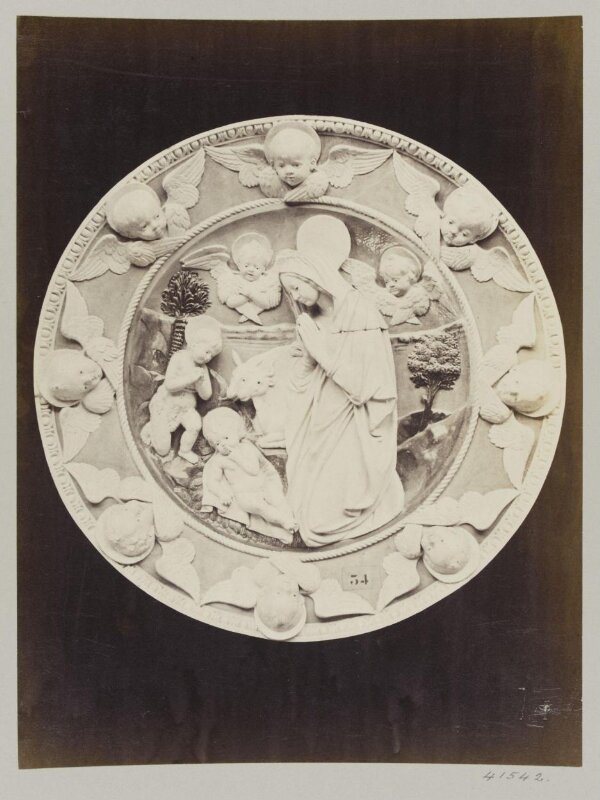 Circular bas-relief depicting the Nativity in enamelled earthenware ...